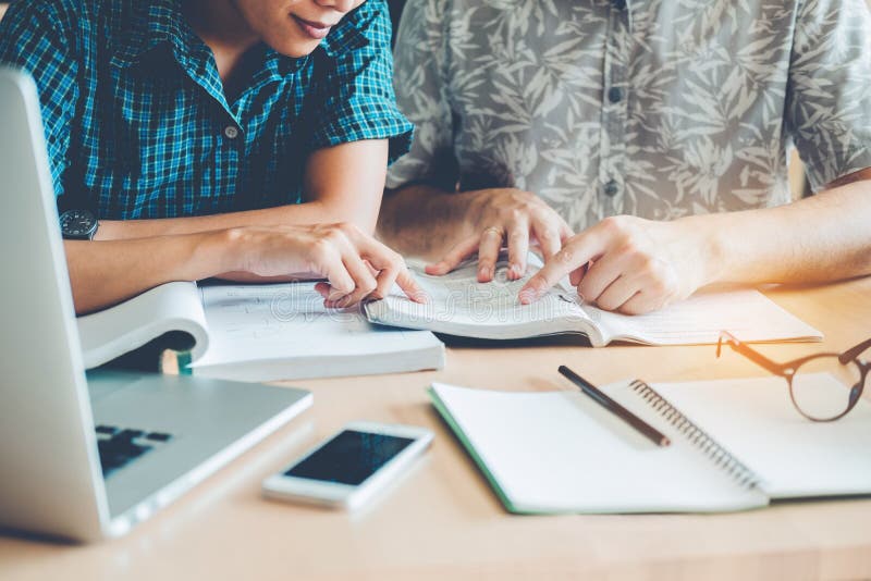 High School or College Students Studying and Reading Together in Stock ...