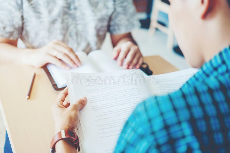 High School or College Students Studying and Reading Together in Stock ...