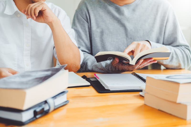 High School or College Students Studying and Reading Together in Stock ...