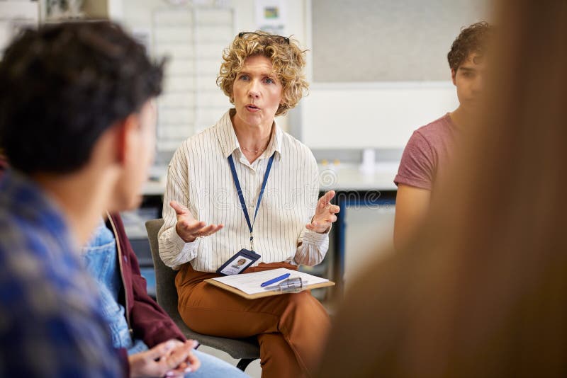 High School Counselor in Conversation with Group of Multiethnic Students Stock Image - Image of ...