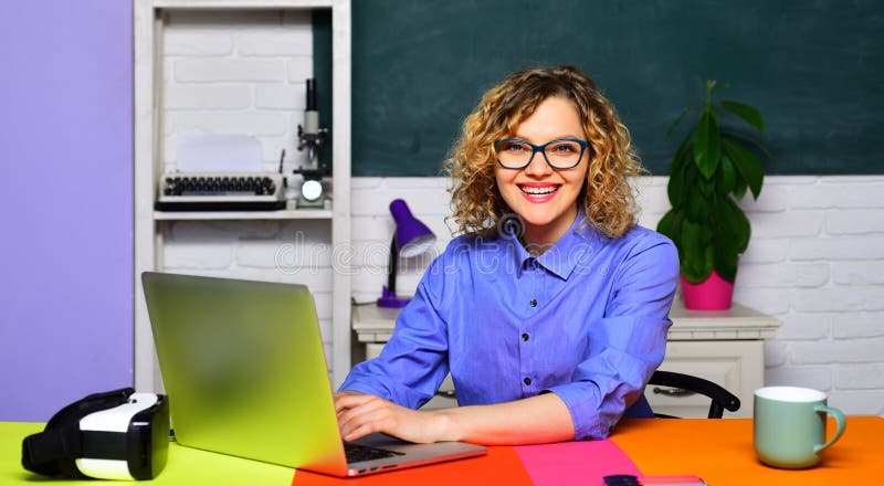 High School. Male University Teacher Working with Notebook Computer in ...