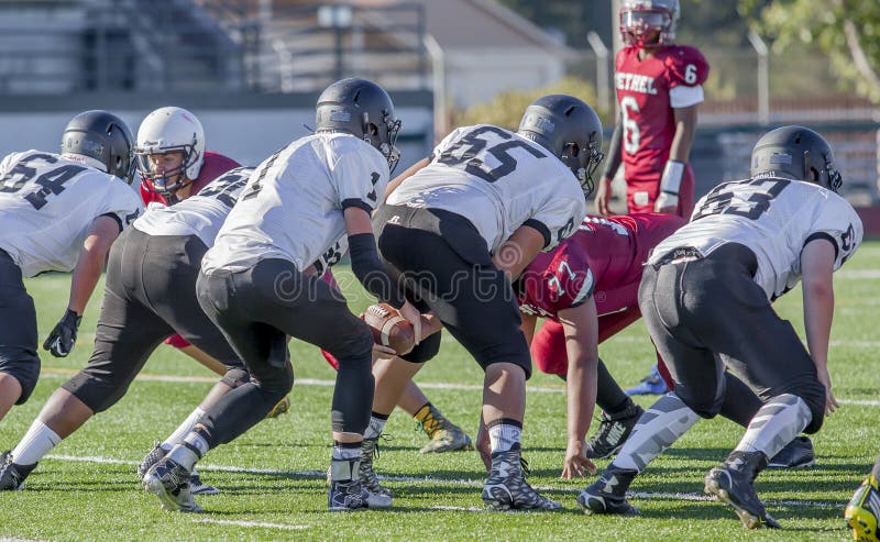 High school football snap stock photo. Image of offense - 99072410