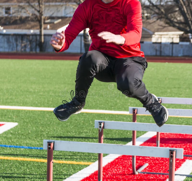 Runner Jumping Over Hurdles for Strngth and Agility Practice Stock ...