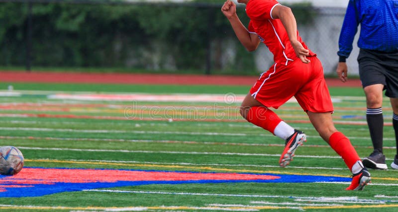 High School Soccer Player Chasing the Ball during a Game Stock Image ...