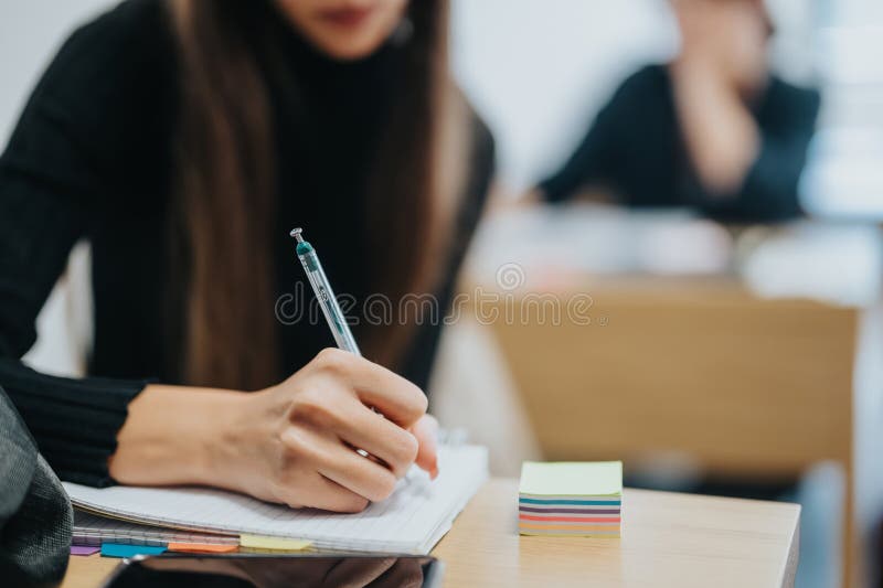 High School Student Focused on Taking Notes during Class Stock Photo ...