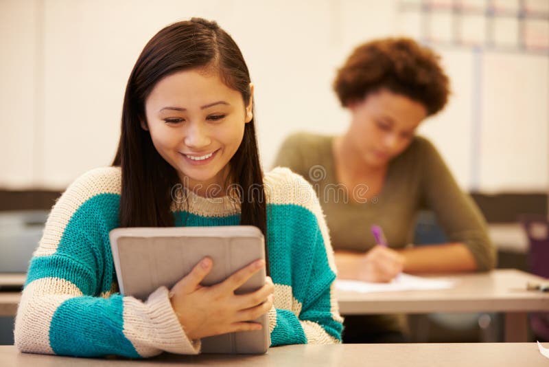 High School Student at Desk in Class Using Digital Tablet Stock Photo ...
