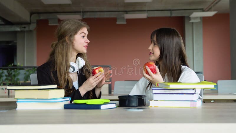 High School Student Girls Eating Lunch. Two Girls at Lunch Time in ...
