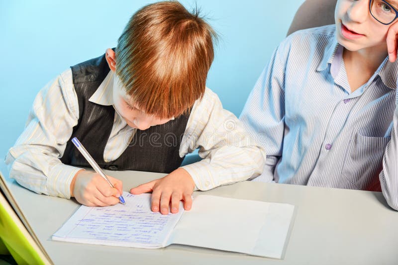 A High School Student Prepares a First Grader in Writing and Preparing ...