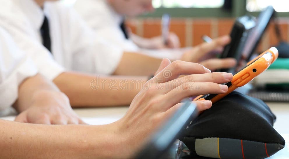 Students Using Digital Technology in the Classroom. Stock Photo - Image ...