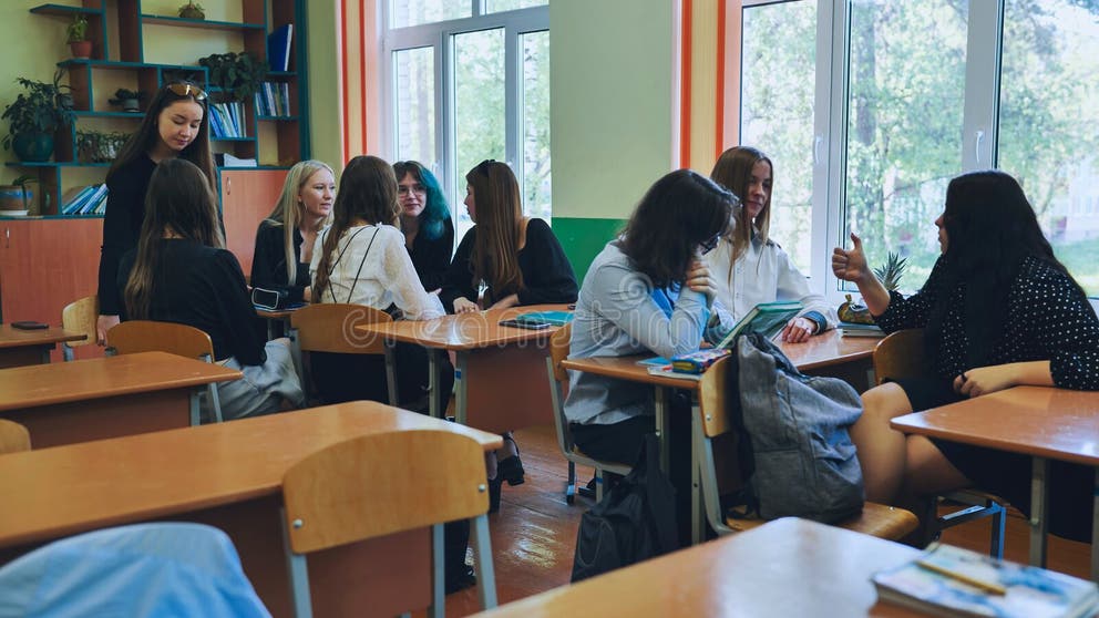 High School Students Collaborating in a Bright Classroom, Engaging in ...