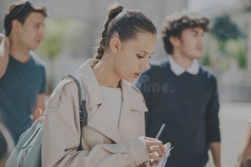 High School Students Collaborating Outdoors with Professor Guidance ...