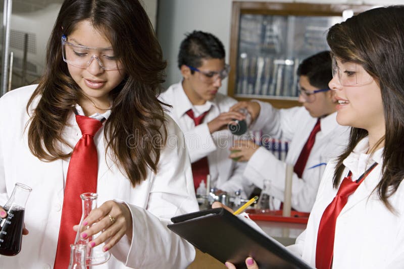 High School Students Conducting Experiment Stock Photo - Image of ...