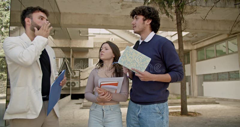 High School Students Consulting with Their Professor after Class ...