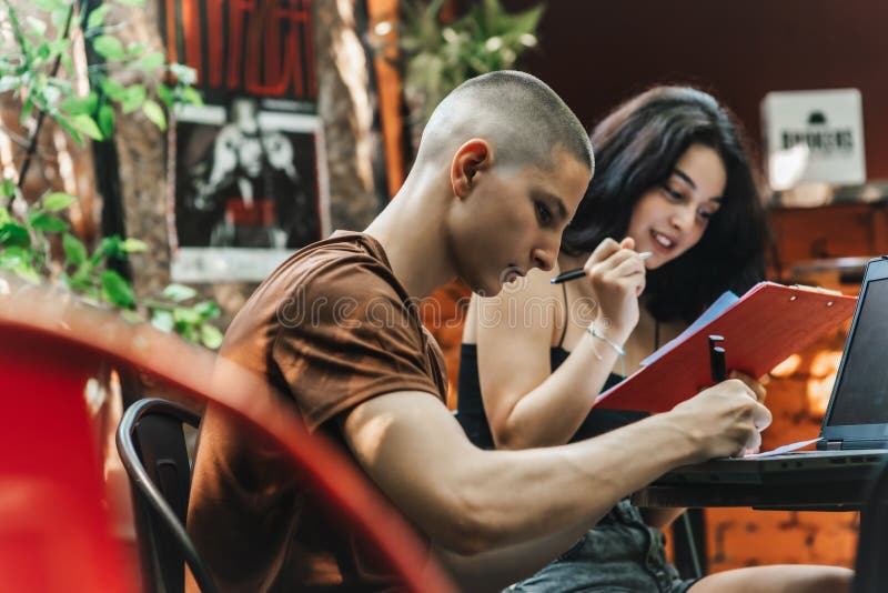 High School Students Discussing Different Topics and Relaxing at a Cafe ... High School Students Discussing Different Topics and Relaxing at a Cafe ...