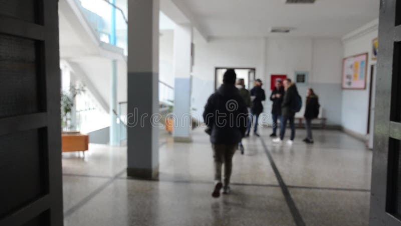High School Students Entering a Classroom. Blurred Pupils Walking Down ...