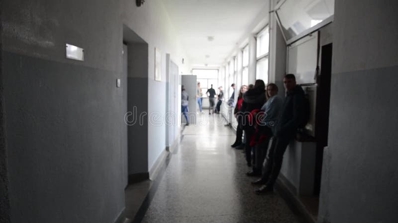 High School Students Entering a Classroom. Blurred Pupils Walking Down ...