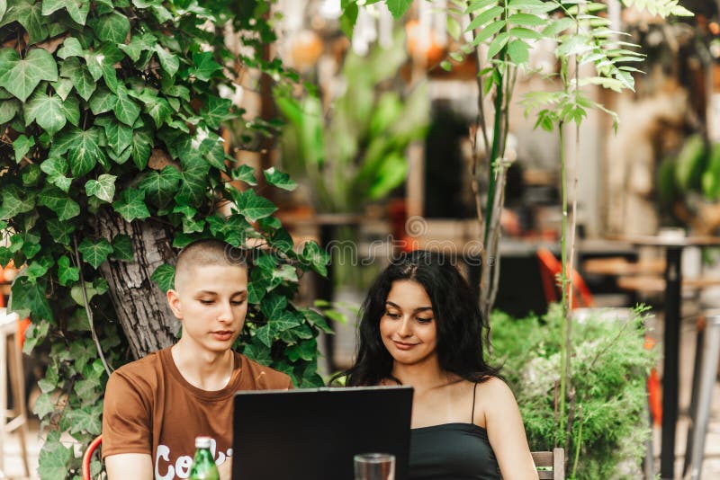 High School Students Gather at a Cafe after Classes, Discussing and ...