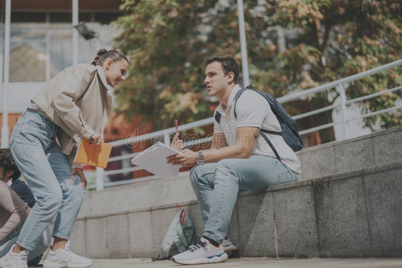 High School Students Getting Help from Teacher Outdoors Stock Image ...