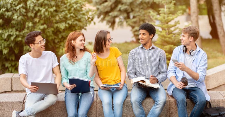 High-School Students Learning Doing Homework Together Sitting Outside ...