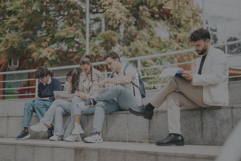 High School Students Learning Outdoors with Guidance from Professor ...