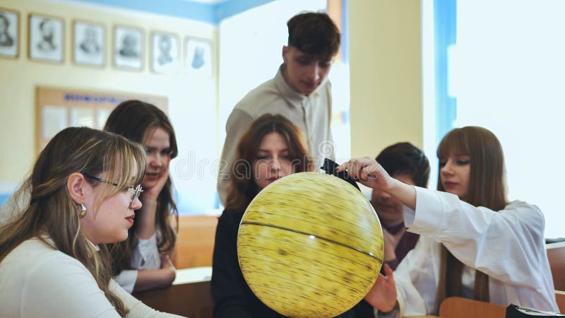 High School Students Looking at the Yellow Globe of the Moon. Stock ...