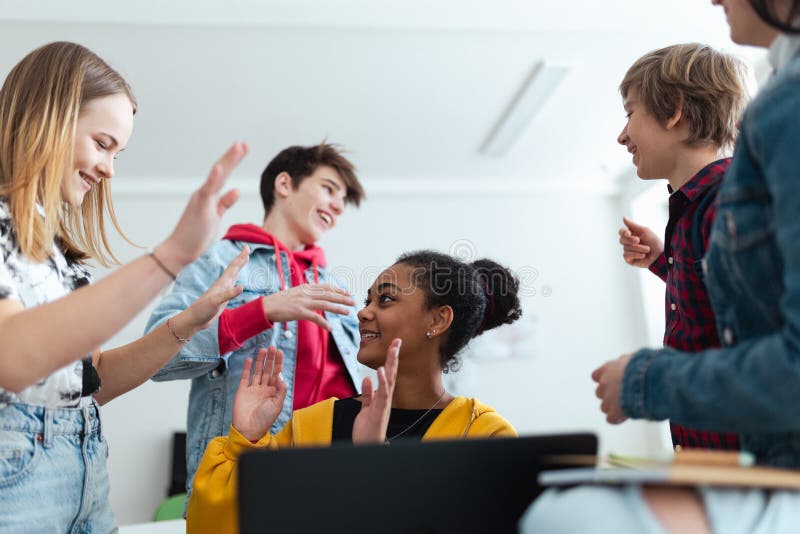 High School Students Meeting and Greeting in Classroom after School ...