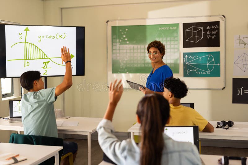 In High School, Students Raising Hands in Classroom while Teacher ...