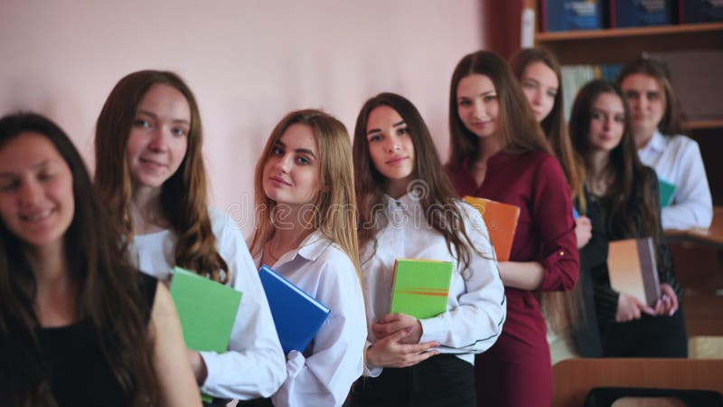 High School Students are in a Row in the Classroom with Textbooks ...