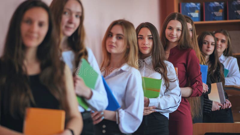 High School Students are in a Row in the Classroom with Textbooks ...