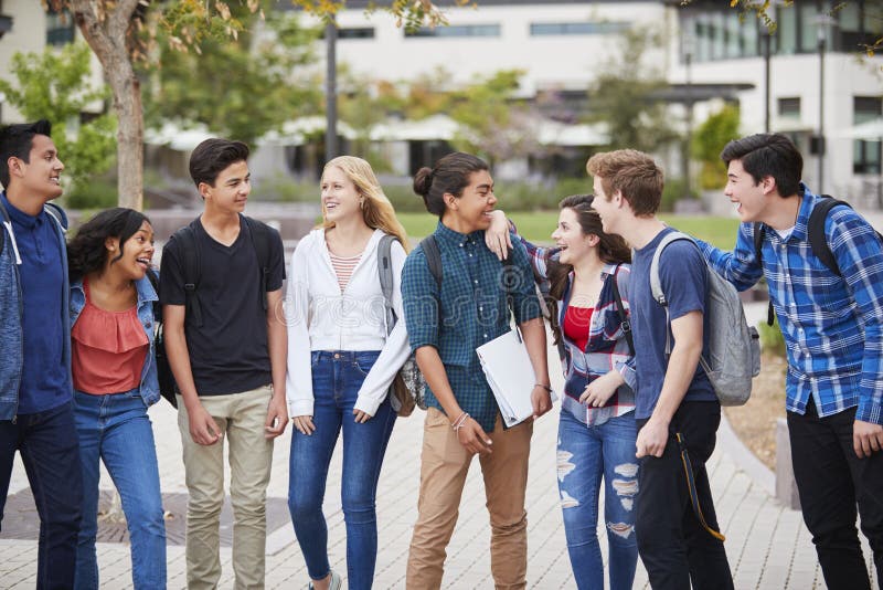 High School Students Socializing Outside College Buildings Stock Photo ...