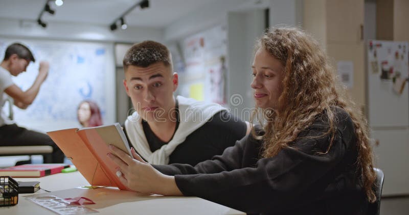 High School Students Study Together during Class. they Discuss Notes ...