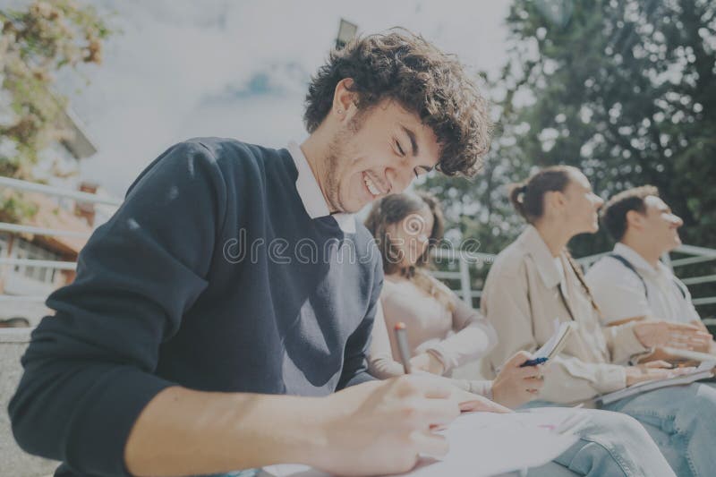 High School Students Studying Outdoors with Professor Assistance and ...