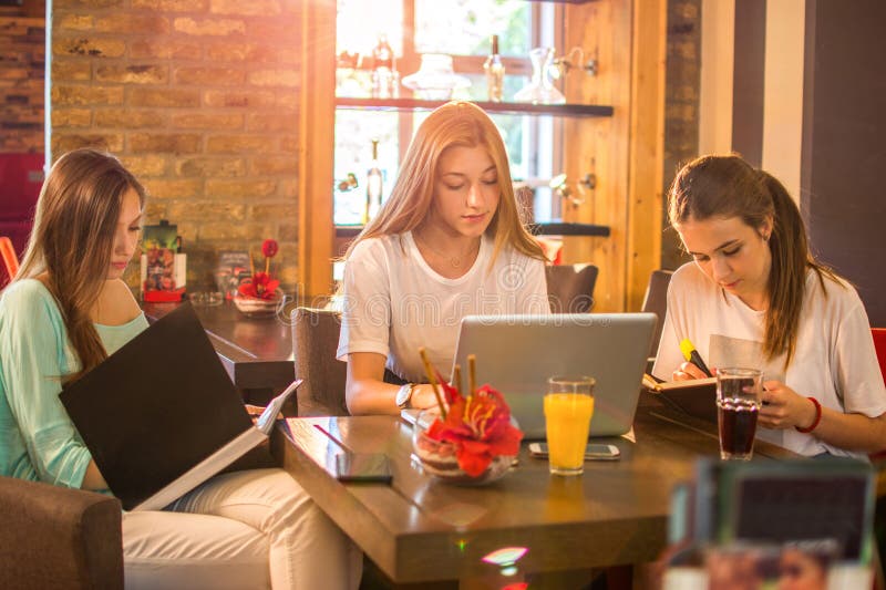 High School Students Studying Together in a Cafe. Stock Photo - Image ...