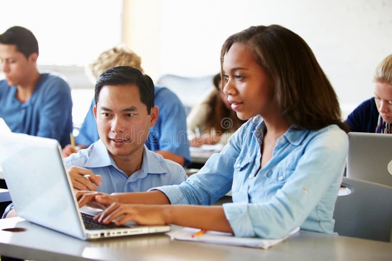 High School Students with Teacher in Class Using Laptops Stock Photo ...
