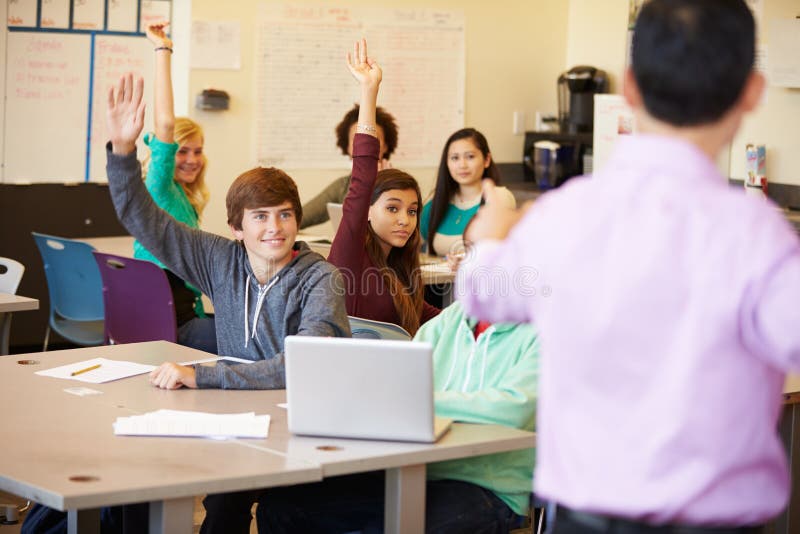 High School Students with Teacher in Class Using Laptops Stock Photo ...
