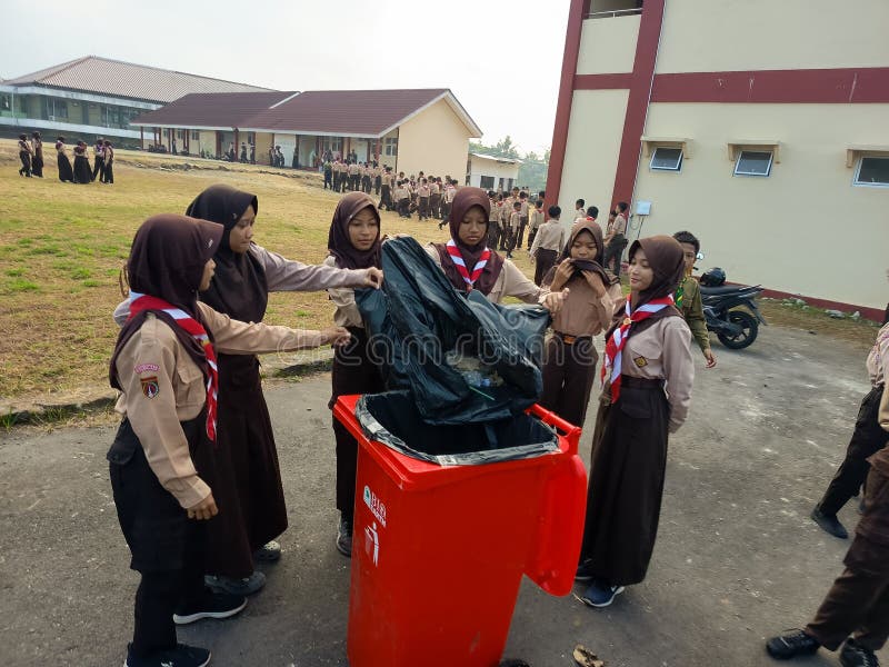 High School Students, Wearing Scout Uniforms, Participate in a Cleaning ...
