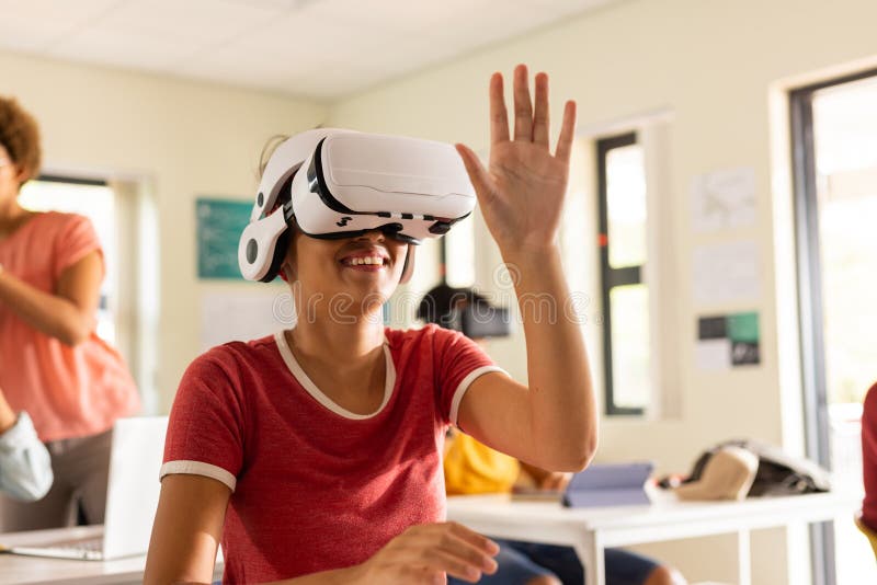In High School, Teenager Using VR Headset and Interacting with Virtual ...