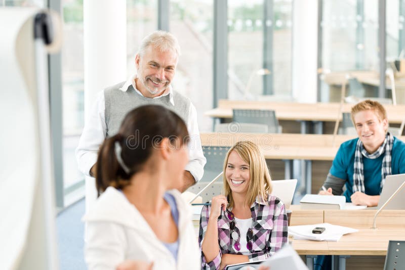 High School - Three Students with Mature Professor Stock Image - Image ...