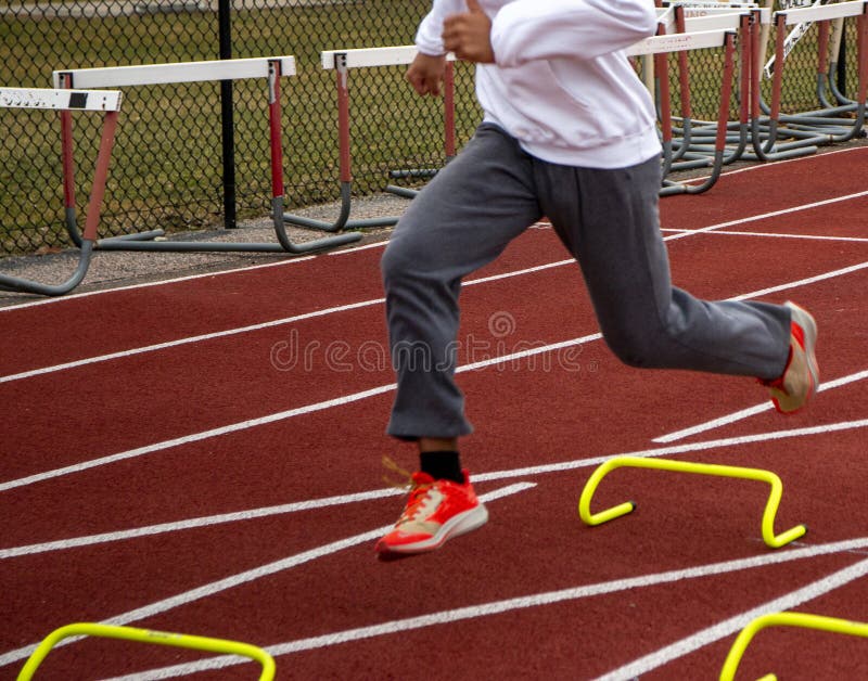 Runner Running Over Yellow Mini Hurdles in Practice Stock Image - Image ...