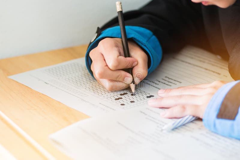 High School or University Student Hands Taking Exams, Writing ...