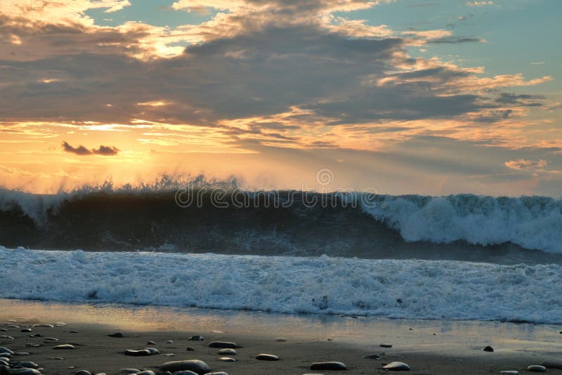 High Sea Waves Crashing on the Shore with Beautiful Sunset Sky ...