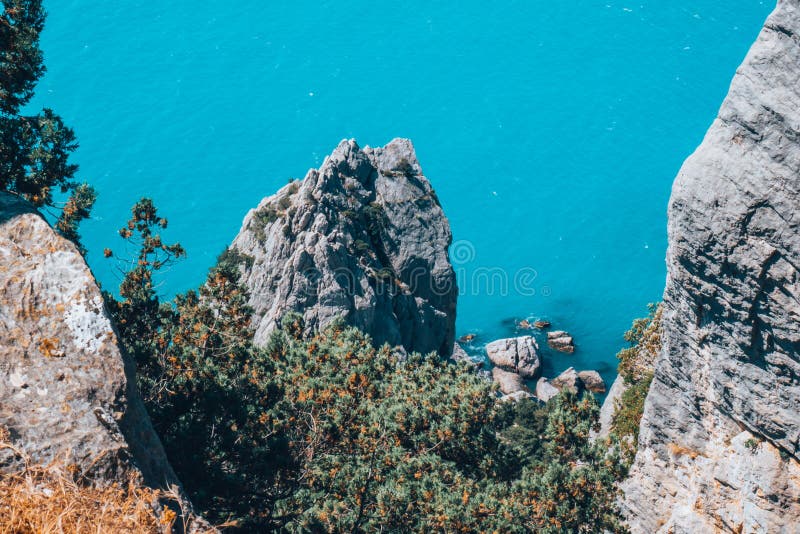 A High Sheer Cliff, Beautiful Blue Sea and Sky. Stock Photo - Image of ...
