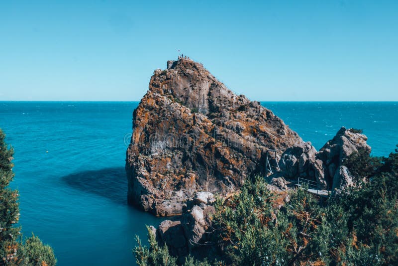A High Sheer Cliff, Beautiful Blue Sea and Sky. Stock Photo - Image of ...