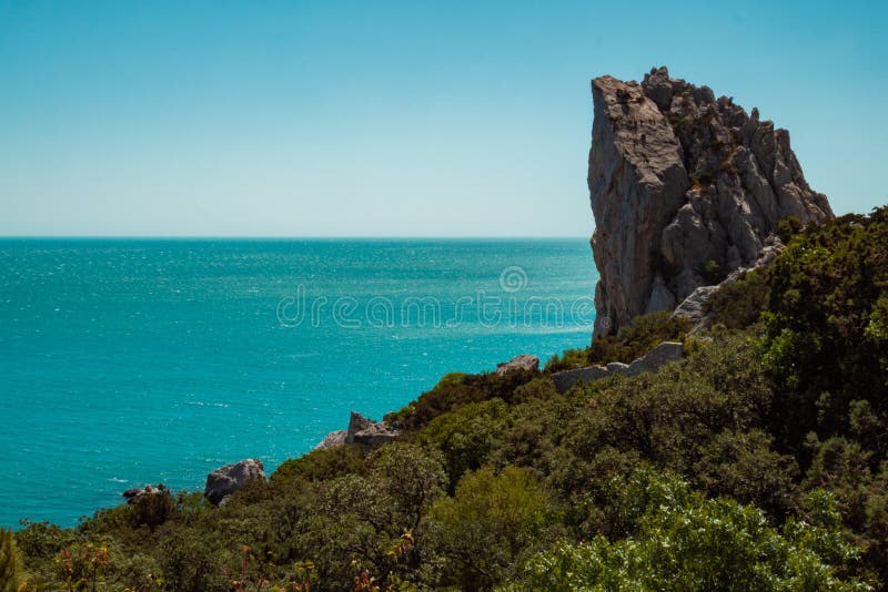 A High Sheer Cliff, Beautiful Blue Sea and Sky. Stock Image - Image of ...