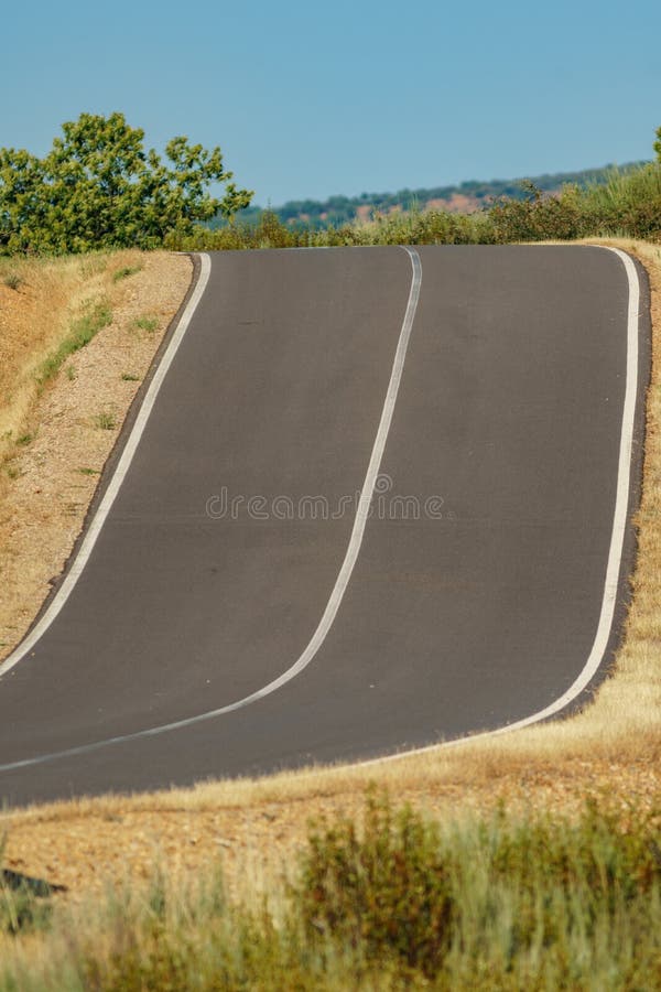Asphalt Road between Rocks with Blurred White Car Stock Photo - Image ...