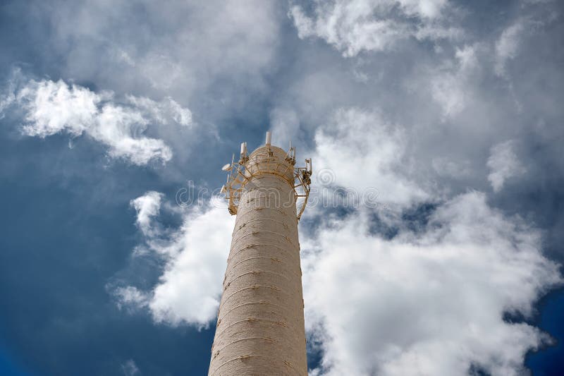 High Smoking Pipe Made of Bricks Against Sky with Clouds Stock Photo ...