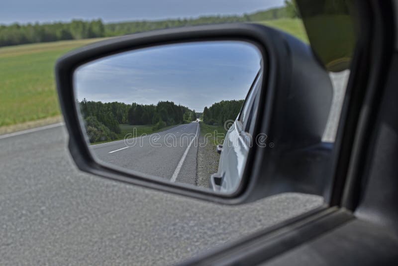 High-speed Asphalt Road in the Reflection of the Car Mirror Stock Image ...