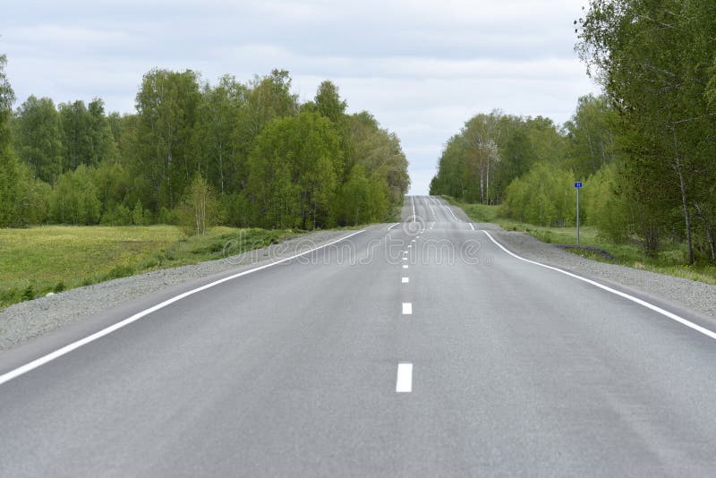 High-speed Asphalt Road in the Spring Forest. Country Road Stock Photo ...