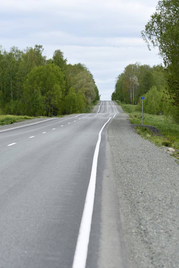 High-speed Asphalt Road in the Spring Forest. Country Road Stock Photo ...