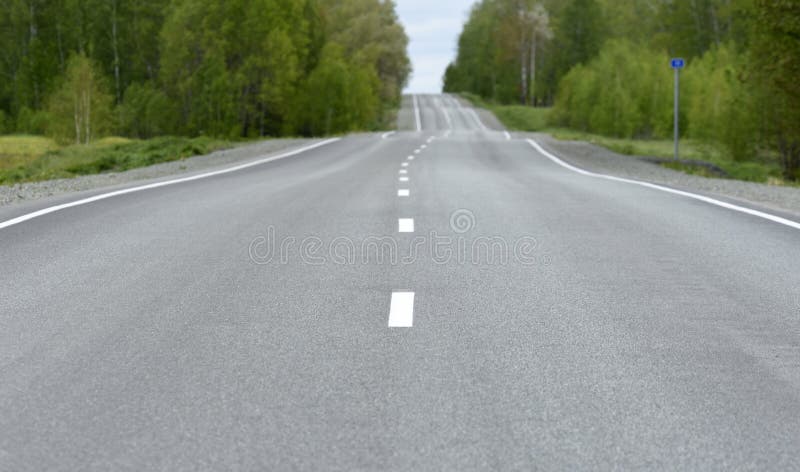 High-speed Asphalt Road in the Spring Forest. Country Road Stock Image ...